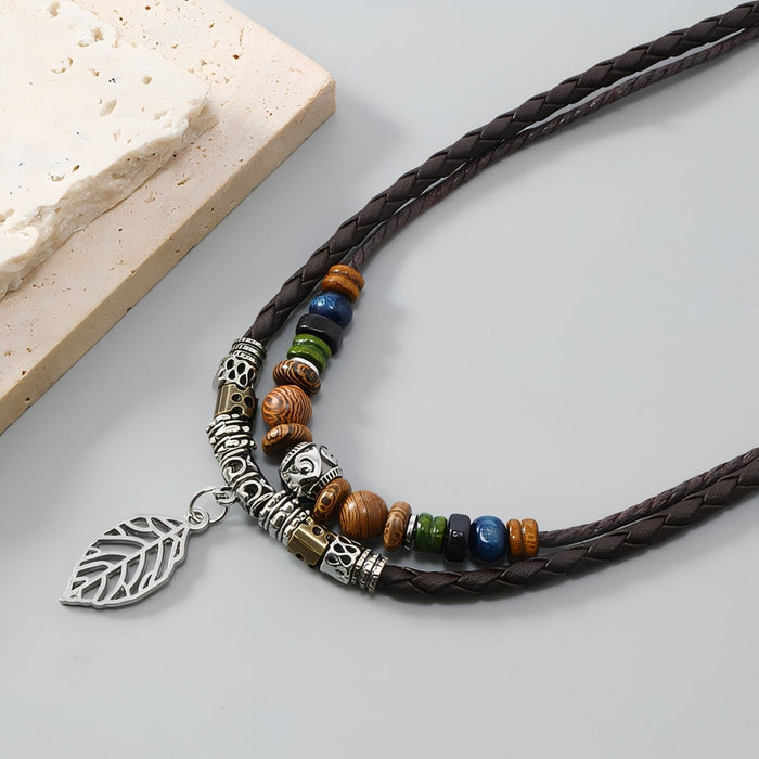 Collier double rangs bohème unisexe, cuir tressé, perles en bois et pe